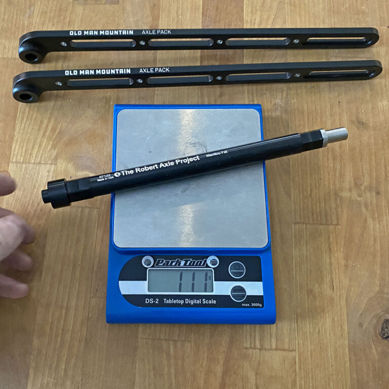 First Look: Old Man Mountain Axle Pack puts Bikepacking Anything Cages ...